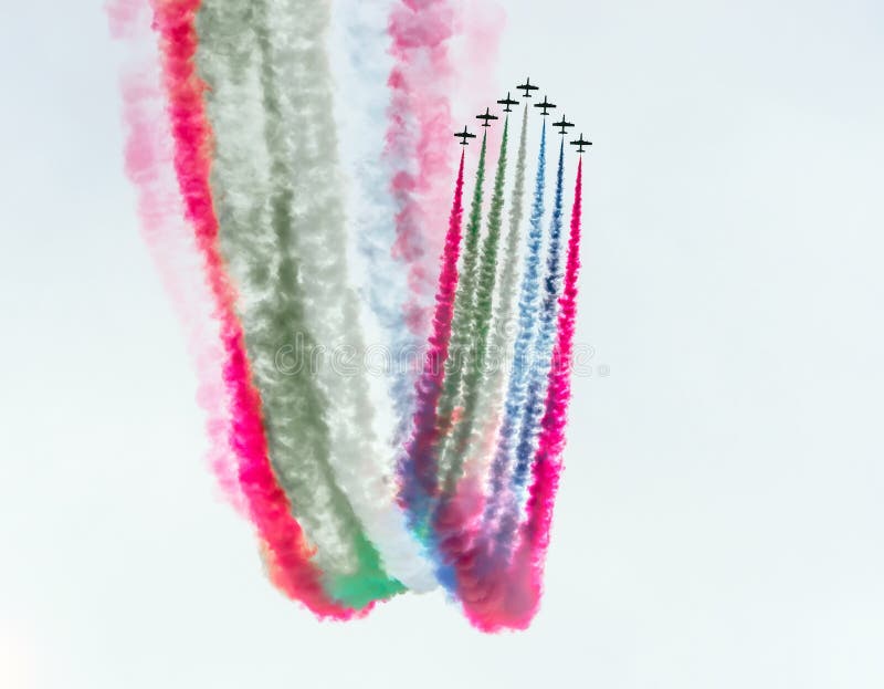 Group of Fighter Jet Airplane with a Trace of Colorful Smoke Against ...