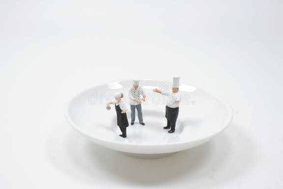 A Group of Figures of Chefs on Saucer Stock Photo - Image of people ...