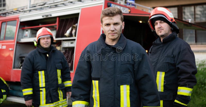 Group of Fire Fighters Standing Confident after a Well Done Rescue ...