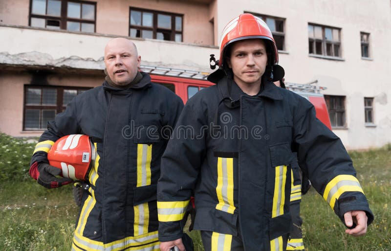 Group of Fire Fighters Standing Confident after a Well Done Rescue ...