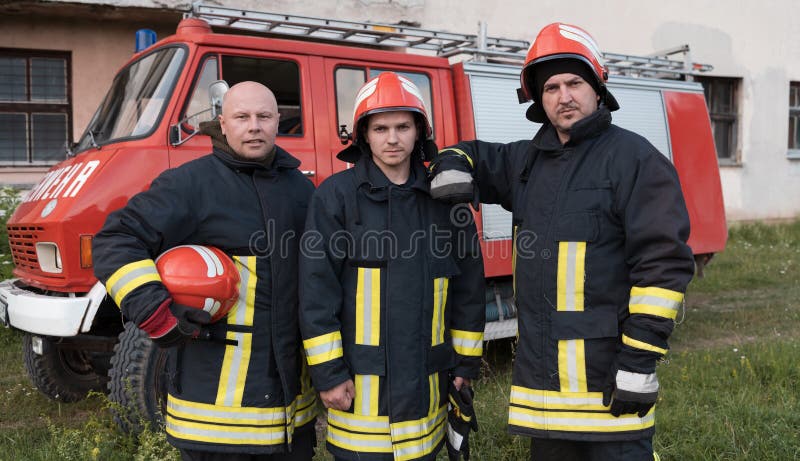 Group of Fire Fighters Standing Confident after a Well Done Rescue ...