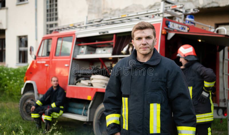 Group of Fire Fighters Standing Confident after a Well Done Rescue ...