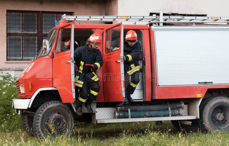 Group of Fire Fighters Standing Confident after a Well Done Rescue ...