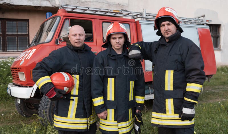 Group of Fire Fighters Standing Confident after a Well Done Rescue ...