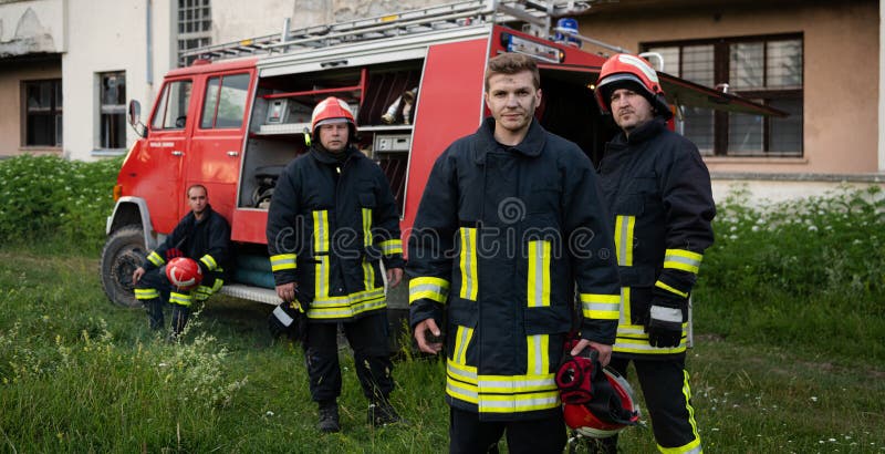 Group of Fire Fighters Standing Confident after a Well Done Rescue ...