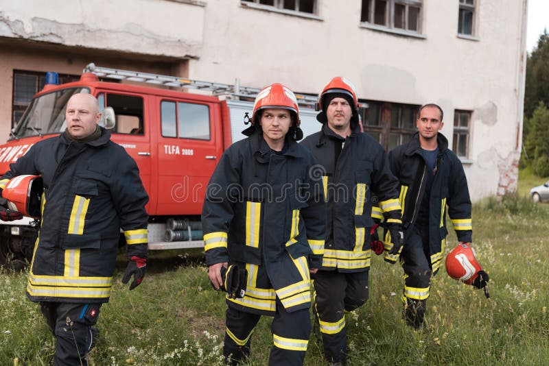 Group of Fire Fighters Standing Confident after a Well Done Rescue ...
