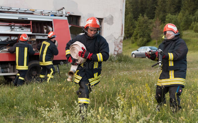 Group of Fire Fighters Standing Confident after a Well Done Rescue ...