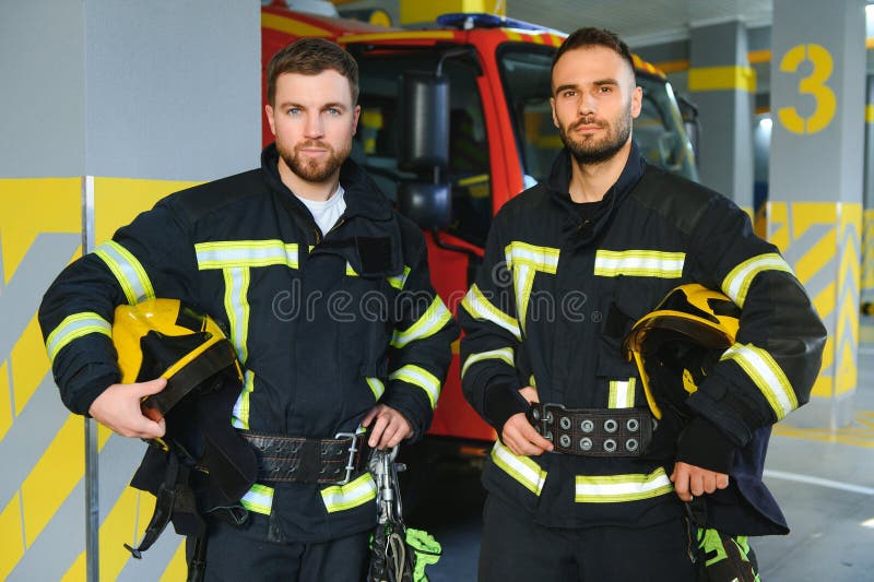 Group of Firefighters at the Emergency Vehicle in the Fire Station ...