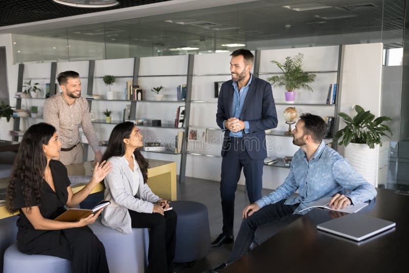 Group of Five Professionals Engaging in Team Meeting in Coworking Stock ...