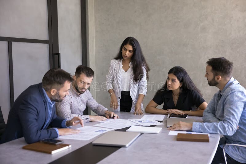 Group of Five Professionals Engaged in Brainstorming or Decision-making ...