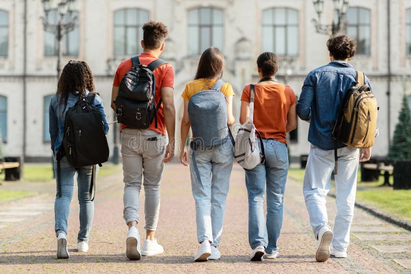 Group of Five Students with Backpacks Walking at University Campus ...