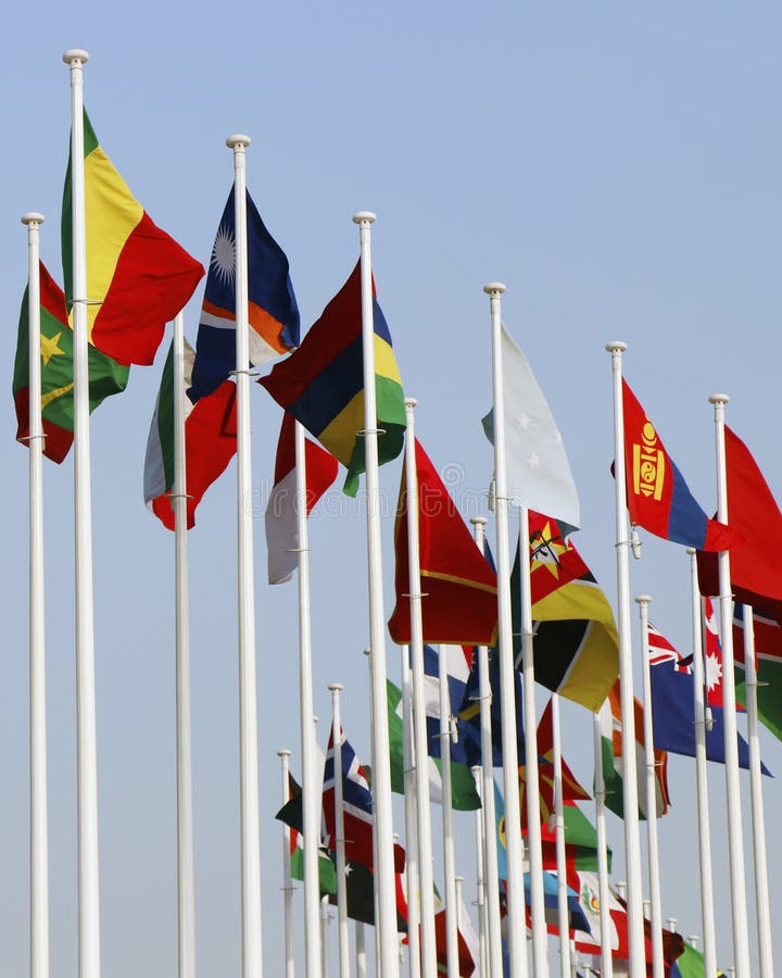 Group of Flags of Many Different Nations Against Blue Sky Stock Image ...