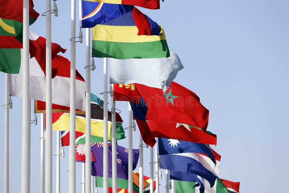 Group of Flags of Many Different Nations Against Blue Sky during Expo ...