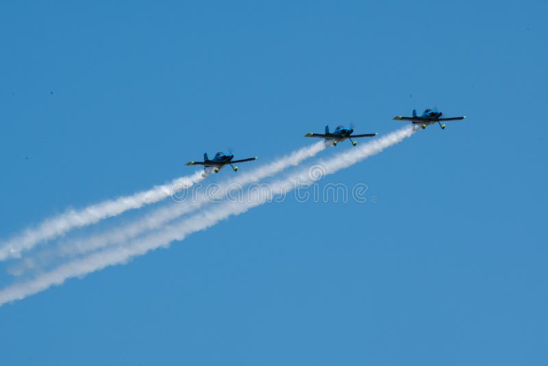 Group of Flying Aircraft Against a Blue Sky during an Airshow Editorial ...