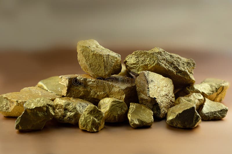Gold Nugget at the Golden Background Stock Image - Image of natural ...