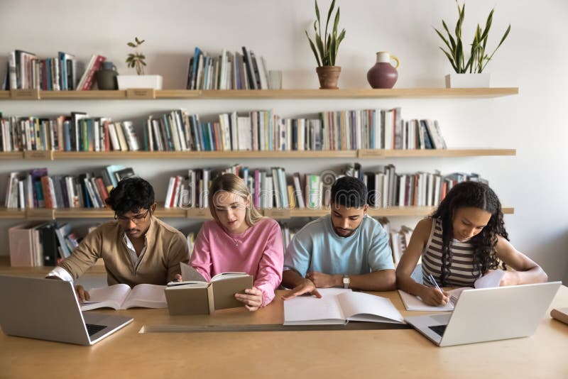 Group of Focused Multinational Students Studying Together in Library ...