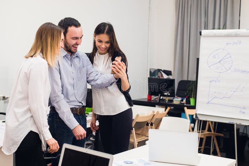 Group of Four Diverse Cheerful Co-workers Taking Self Portrait and ...