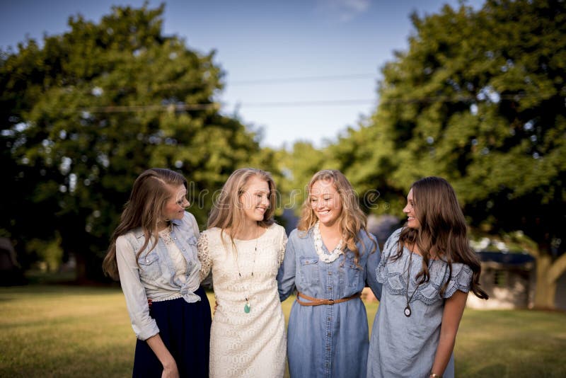 Group of Four Female Friends Hugging Each Other in the Park Stock Image ...