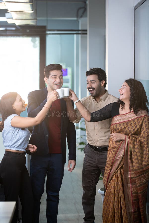 Group of Four Friends Cheering Coffee at Office Stock Image - Image of ...