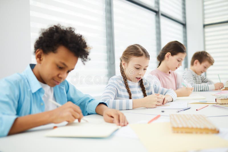 Middle Schoolers Completing Task Stock Photo - Image of schoolgirl ...