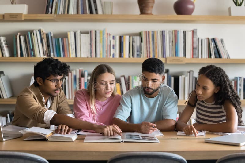 Group of Four Students Engaged in Collaborative Study Session Stock ...