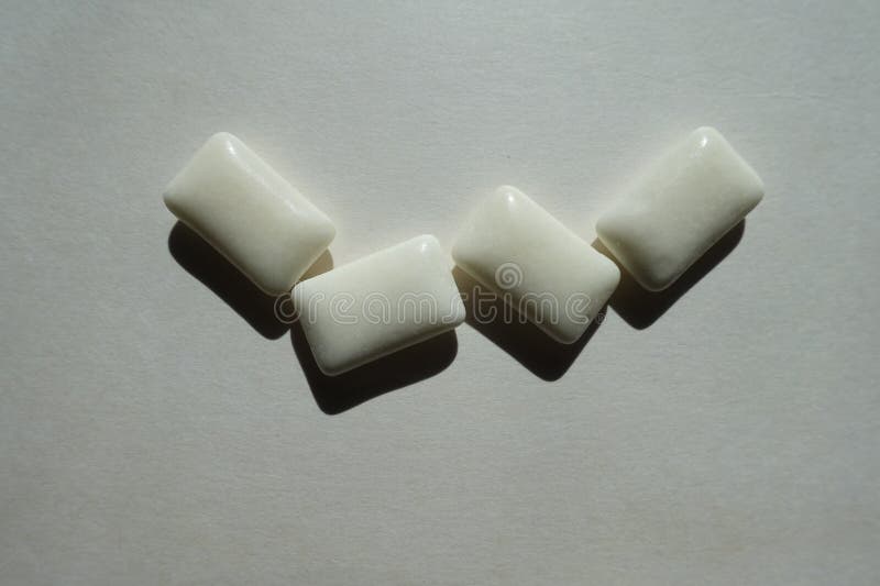 Group of Four White Pieces of Chewing Gum Stock Photo - Image of teeth ...