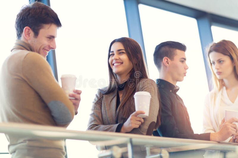 Group of Four Young Business People on a Coffee Break Stock Image ...