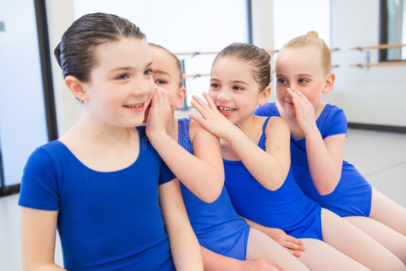 Group of Four Young Girls Telling Secrets Together Stock Image - Image ...