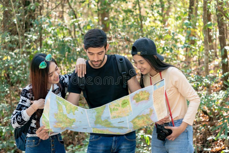 Group of Freind Reading Map on Country Walk Stock Image - Image of ...