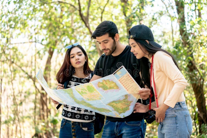 Group of Freind Reading Map on Country Walk Stock Photo - Image of ...
