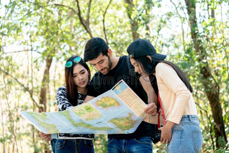 Group of Freind Reading Map on Country Walk Stock Photo - Image of ...