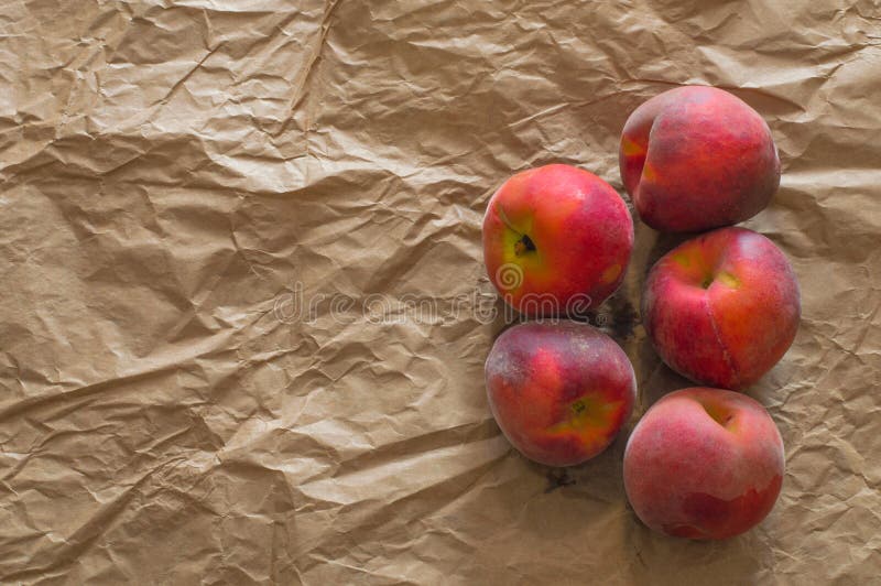 Group of Fresh Organic Peaches on a Craft Paper Stock Photo - Image of ...