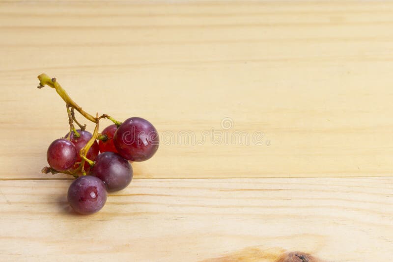 Group of Fresh Red Grape on Wood Table Stock Photo - Image of branch ...