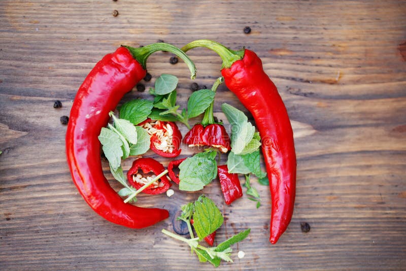 Group of Fresh Red Hot Chilli Peppers on an Old Vintage Wooden Table ...