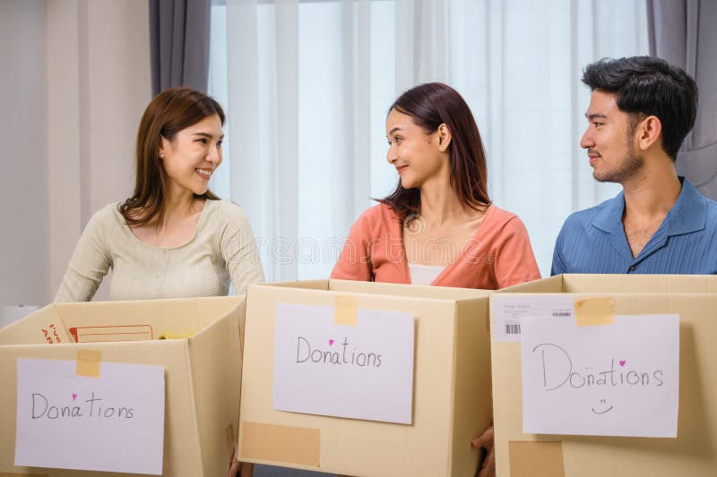 Group of Friend Holding Packing Clothes into a Donation Box.community Support, and Charitable ...