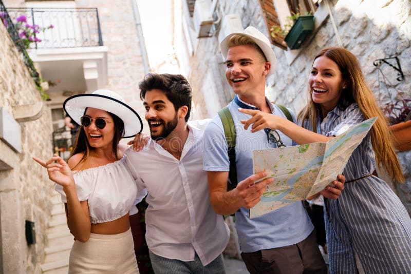 Group of Friend Tourist with Map in Old City on Vacation Stock Photo ...