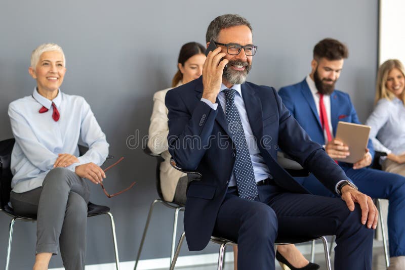Group of Friendly Businesspeople with Male Leader in Front Stock Photo ...