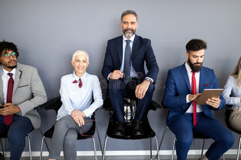 Group of Friendly Businesspeople with Male Leader in Front Stock Image ...