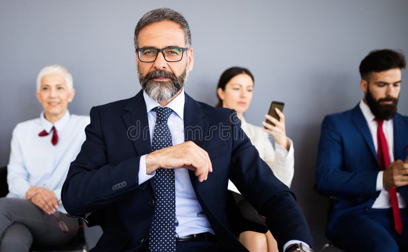 Group of Friendly Businesspeople with Male Leader in Front Stock Photo ...