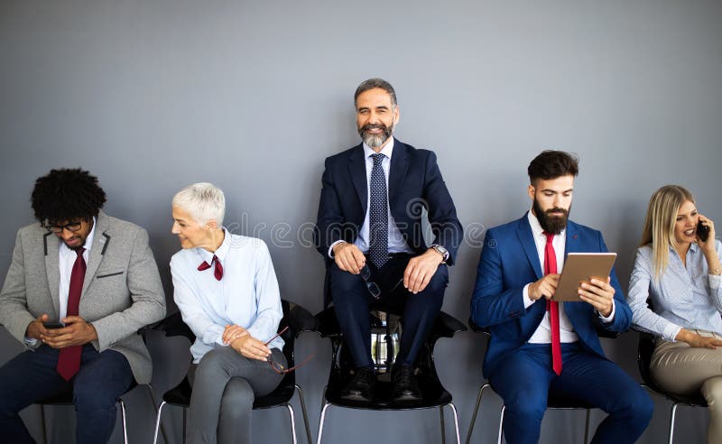 Group of Friendly Businesspeople with Male Leader in Front Stock Image ...