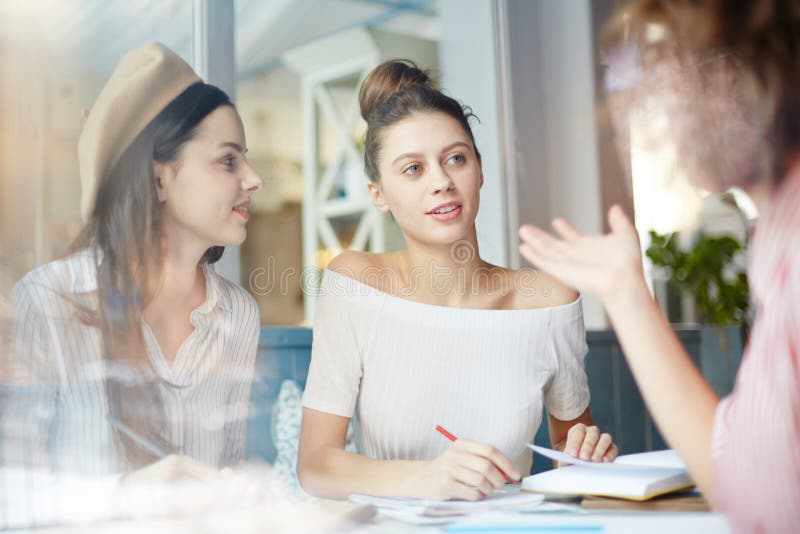 Girls discussing ideas stock photo. Image of idea, adult - 113935740