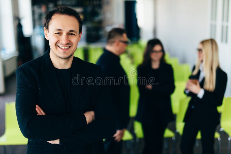 Group of Friendly Young Businesspeople with Male Leader in Front Stock ...
