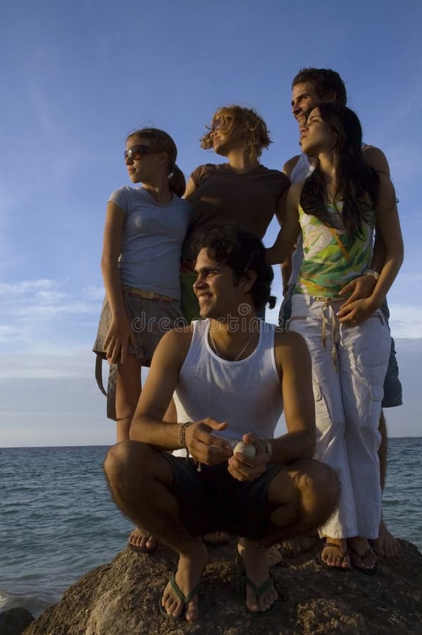 Happy friends on the beach stock image. Image of beautiful - 4262479