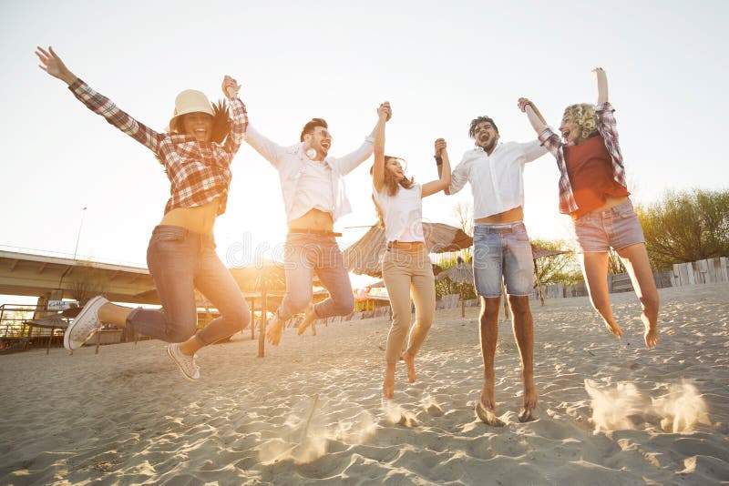 Group of Friends on Beach Having Fun Stock Photo - Image of success ...