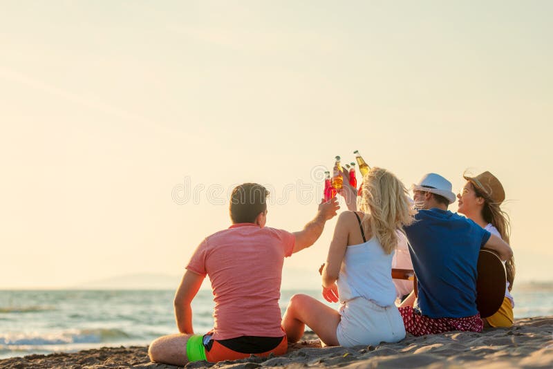 Group of Friends Play on the Beach Stock Image - Image of group ...