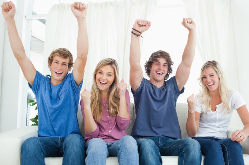Friends Laugh Around while Watching a Movie Stock Photo - Image of ...