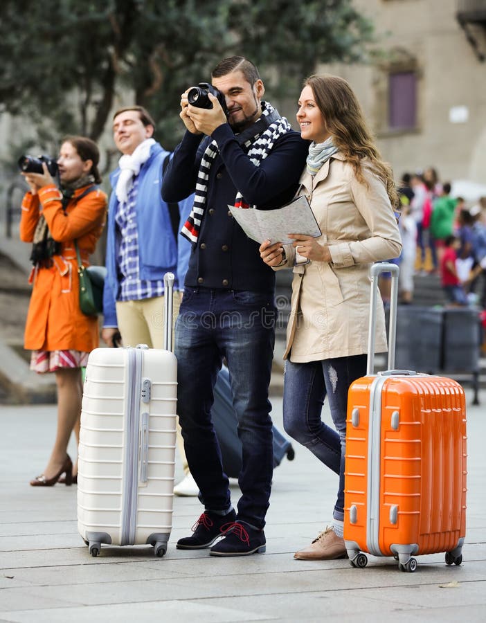 Group of Friends Checking Direction Stock Photo - Image of carrying ...