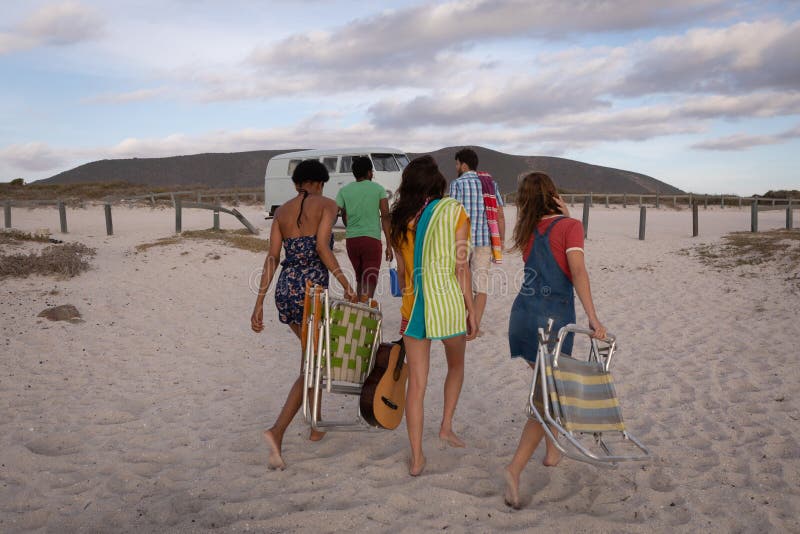Group of Friends Come Back from Beach To Join Their Camper Van Stock ...