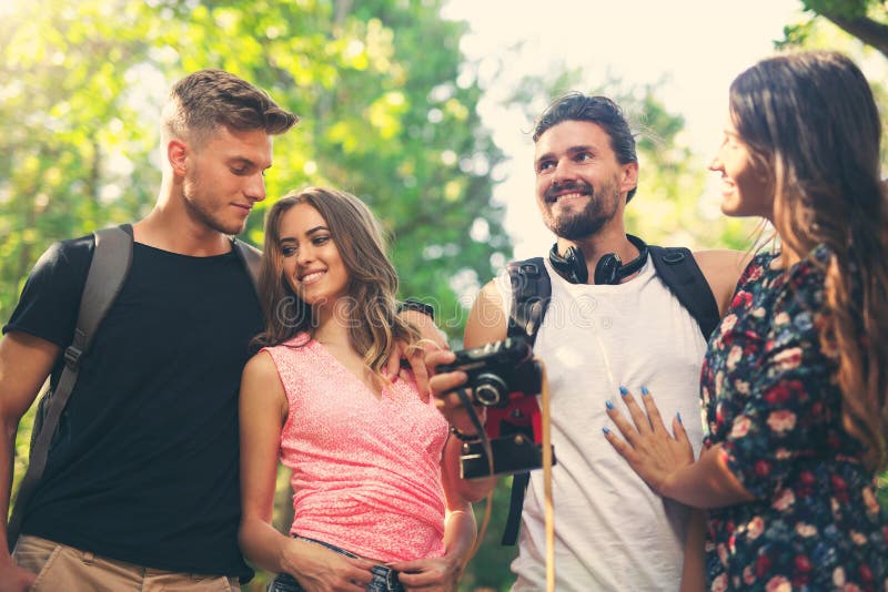 Group of Friends or Couples Having Fun with Photo Camera Stock Image ...