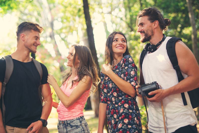 Group of Friends or Couples Having Fun with Photo Camera Stock Photo ...